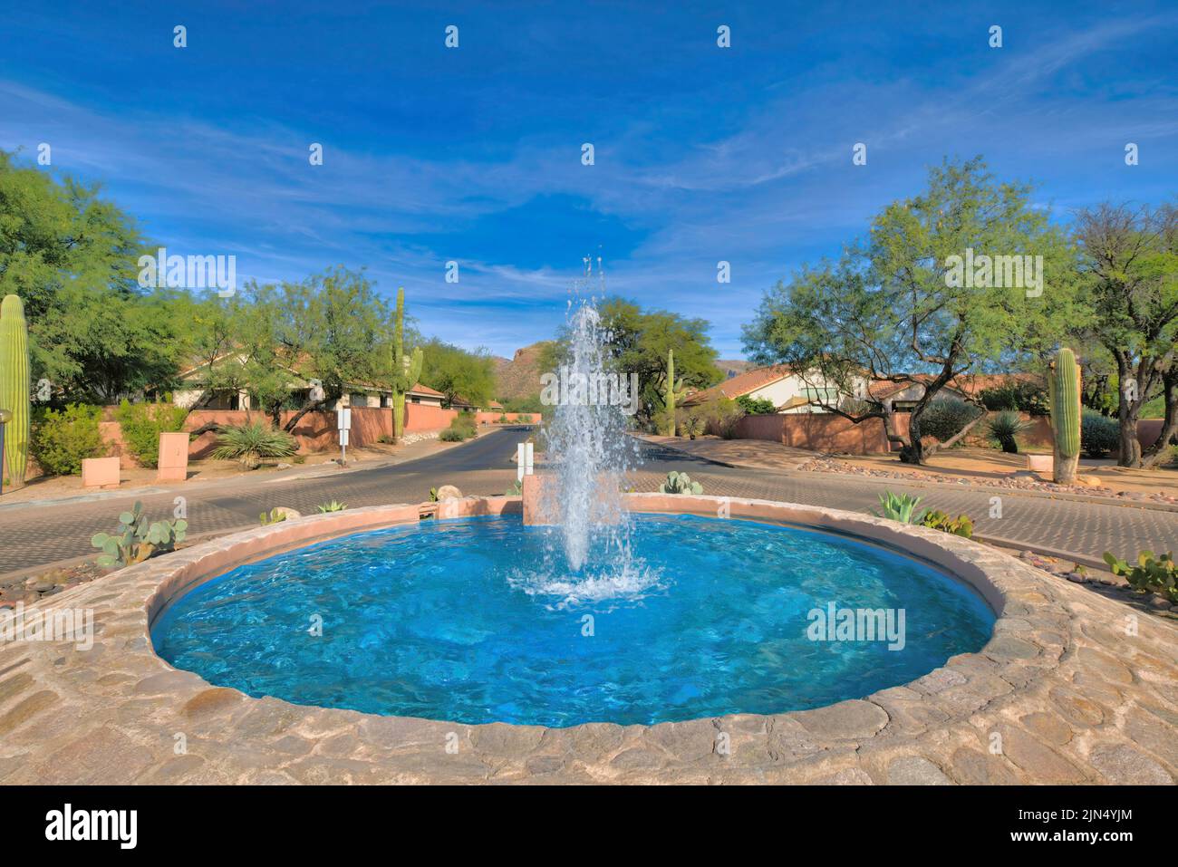 Rotational road with water fountain in the middle at the suburbs of ...