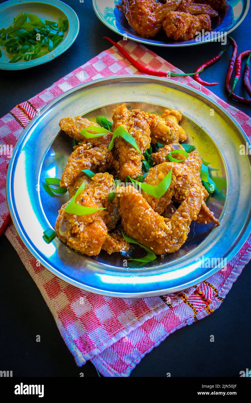 Delicious homemade crispy fried chicken with spicy taste and lemon on ...