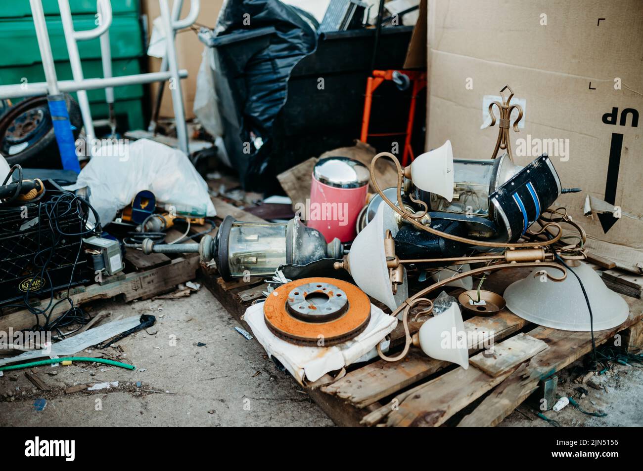 A collection of old and used household goods scattered around in the ...