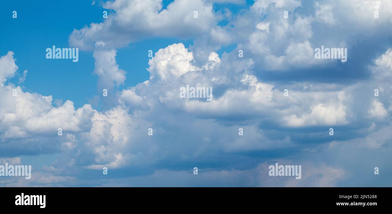 Panorama of white high clouds on bright blue sky, cloudscape background ...