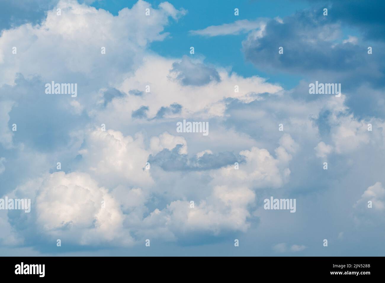 Fluffy white clouds on bright blue sky, cloudscape background. Skyscape ...