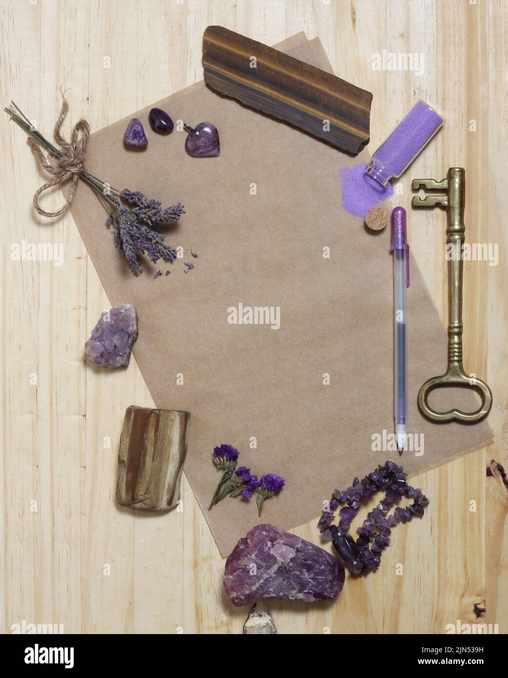 Amethyst Stones With Petrified Wood on Old Paper With Dried Flowers ...