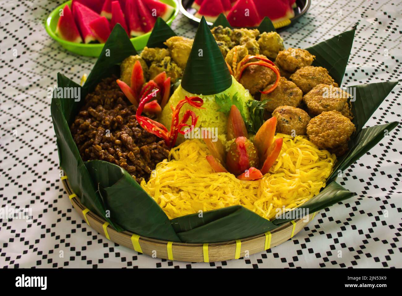 nasi kuning or yellow rice or tumeric rice is traditional food from ...