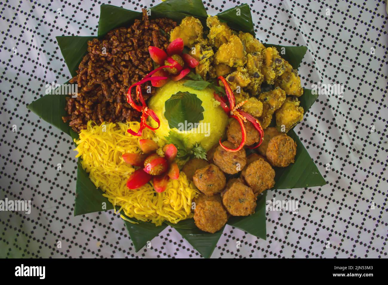 "nasi kuning or yellow rice or tumeric rice is traditional food from ...