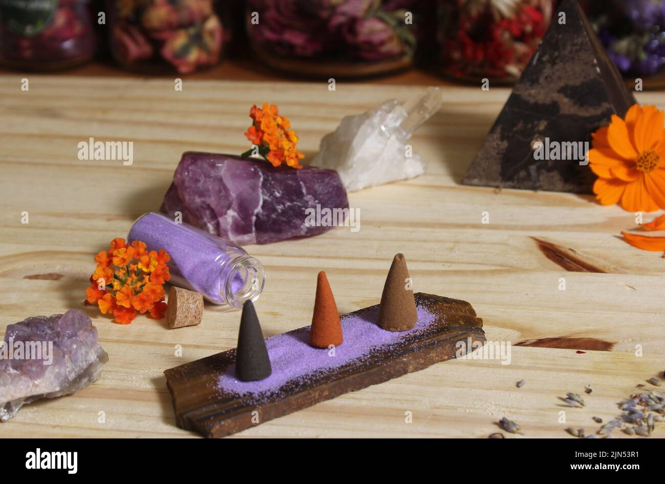 Incense Cones on Stone Slab With Rock Crystals and Flowers Stock Photo ...