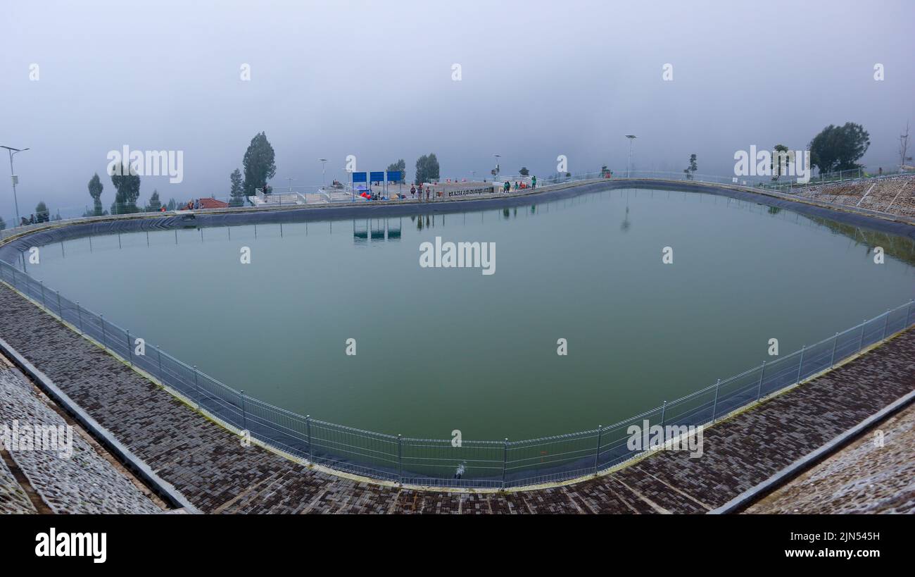 "Aerial view of a rainwater retention basin in morning with foggy ...