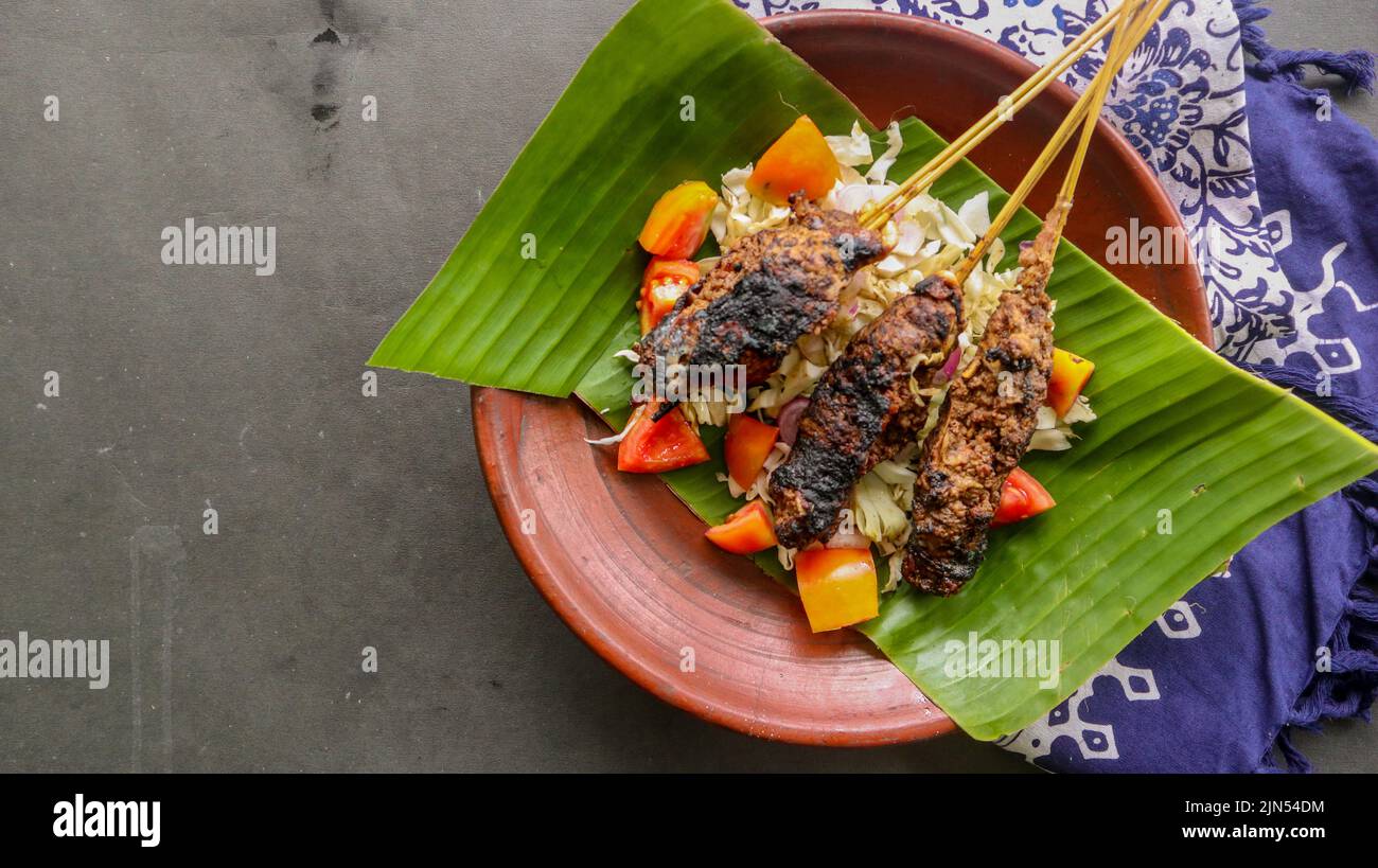 sate buntel or satay buntel is satay made from minced mutton wrapped in ...