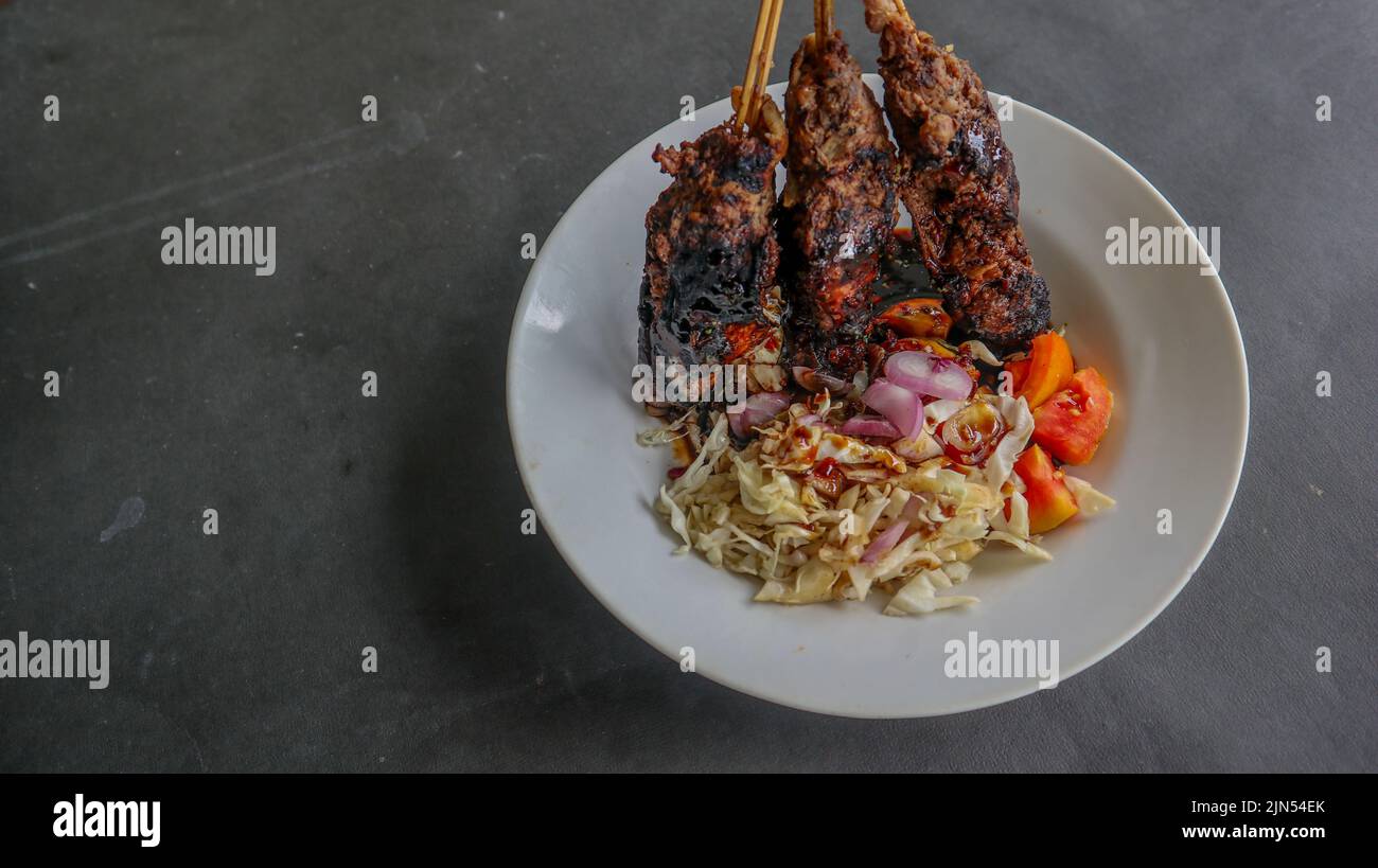 sate buntel or satay buntel is satay made from minced mutton wrapped in ...