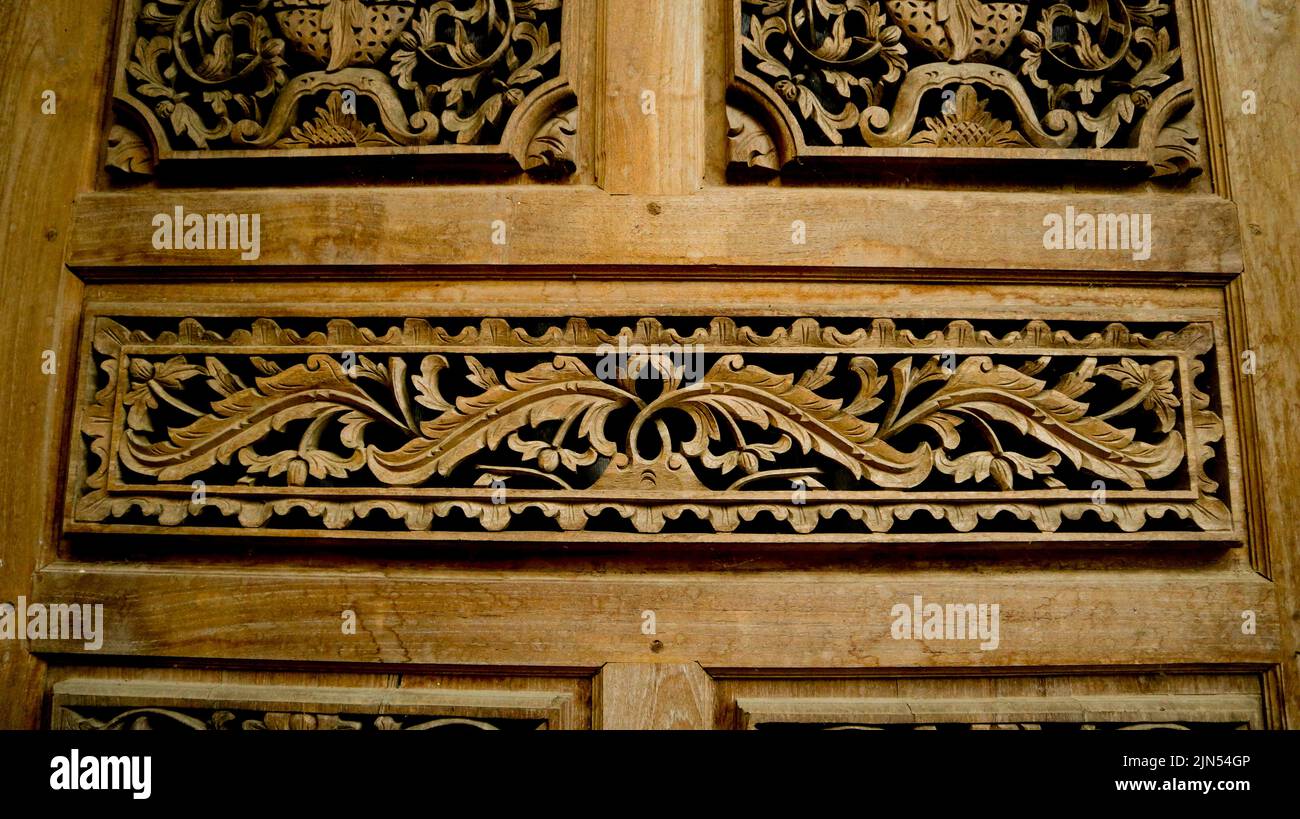 wood carving, floral pattern carved on wooden background. gebyok Stock ...