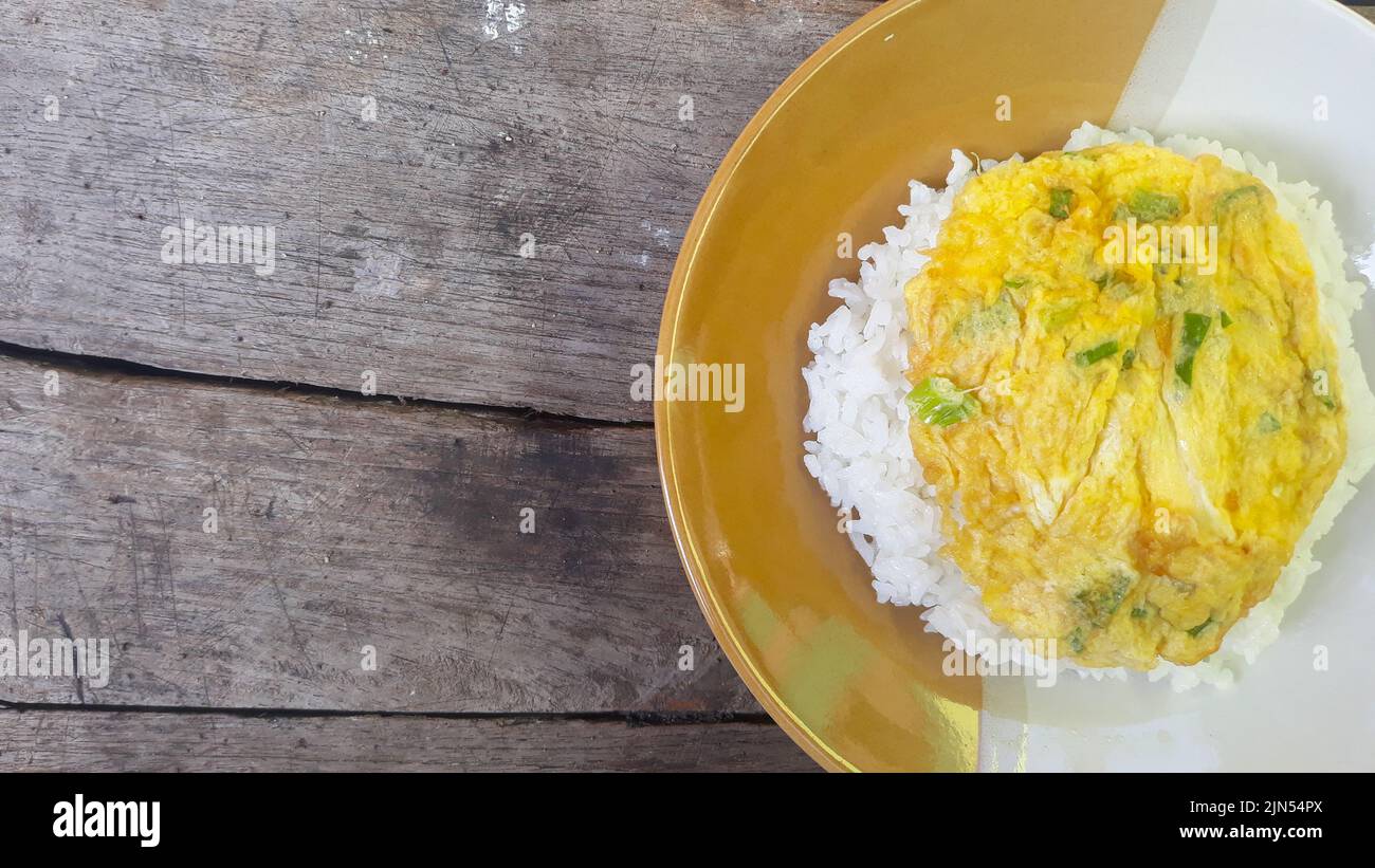 fried egg omelet with rice. breakfast fried egg omelet rice on a plate ...