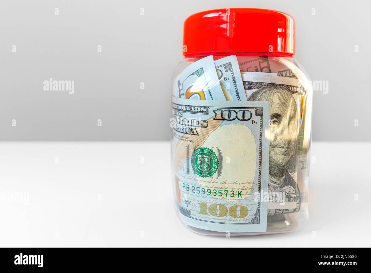 Money in a glass jar Stock Photo - Alamy