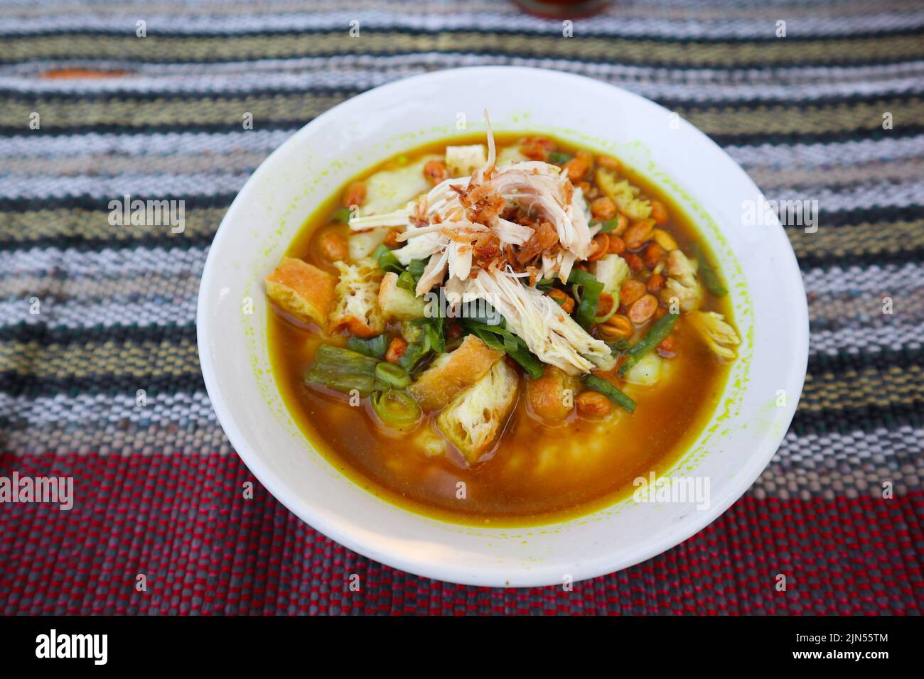 bubur ayam or chicken porridge or rice gruel, made from served with ...