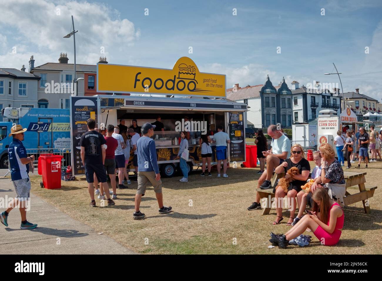 The food stands and people hanging out at the beach bbq festival in ...