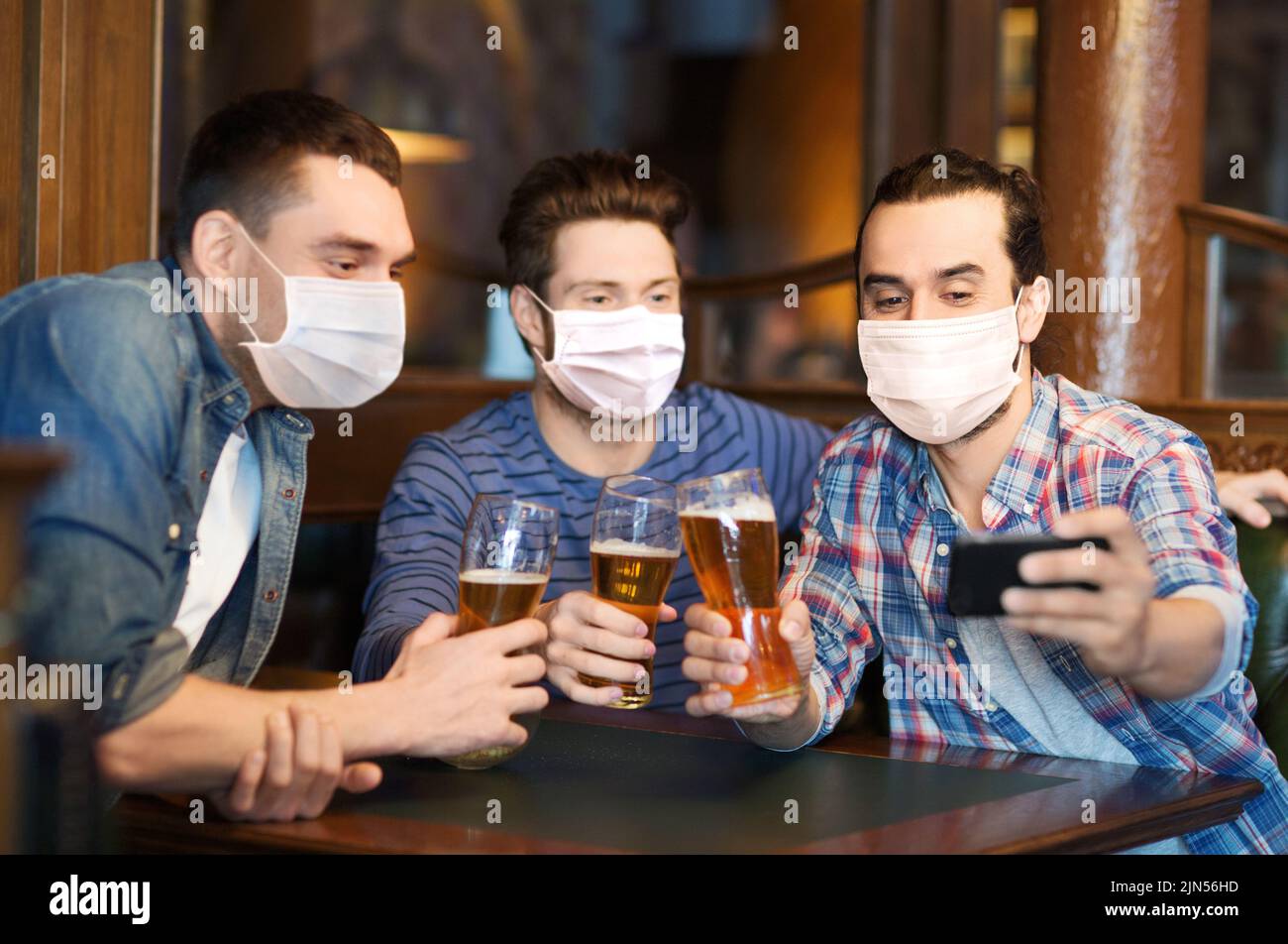 Men in masks take hi-res stock photography and images - Alamy