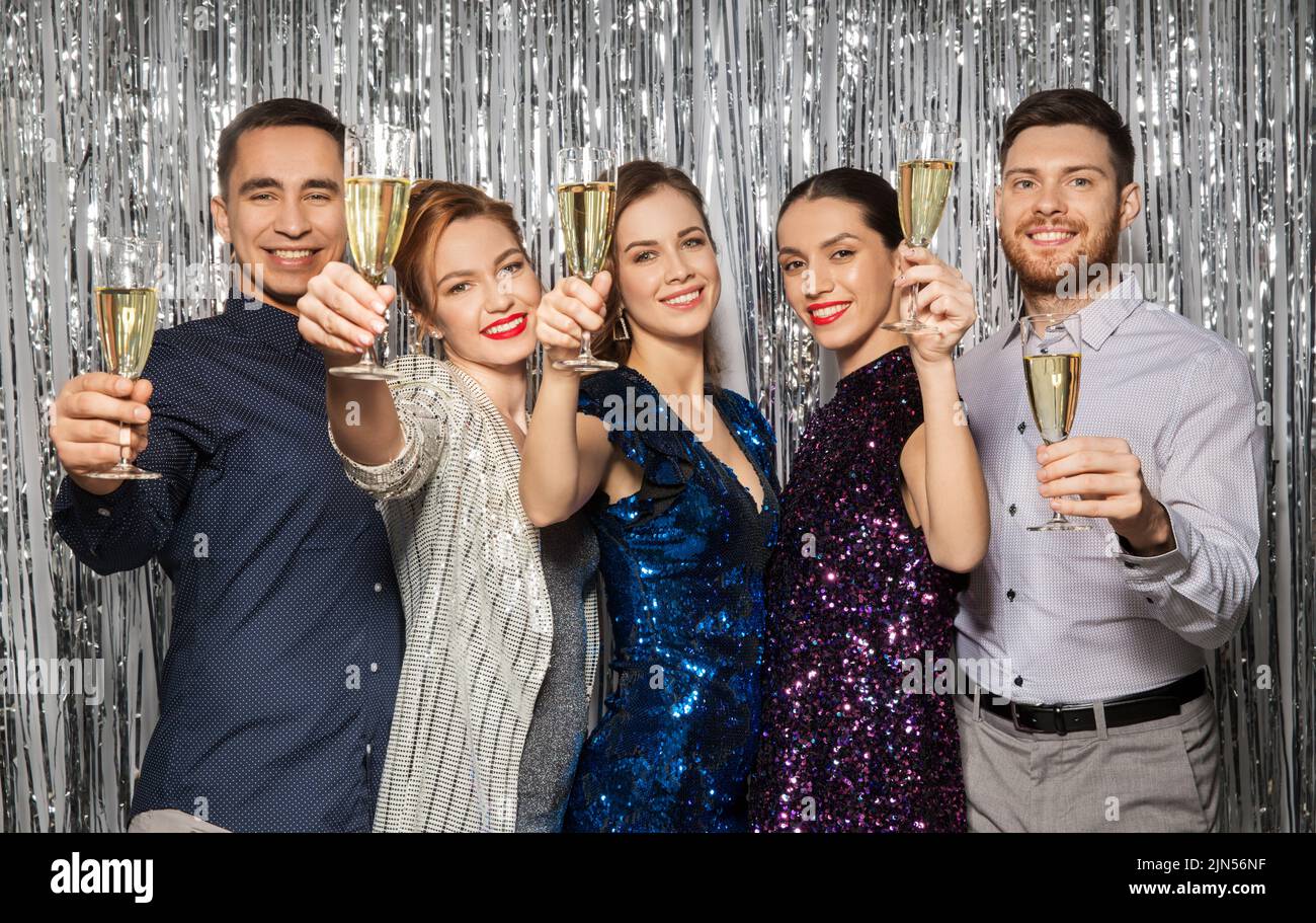 Happy friends toasting champagne hi-res stock photography and images ...