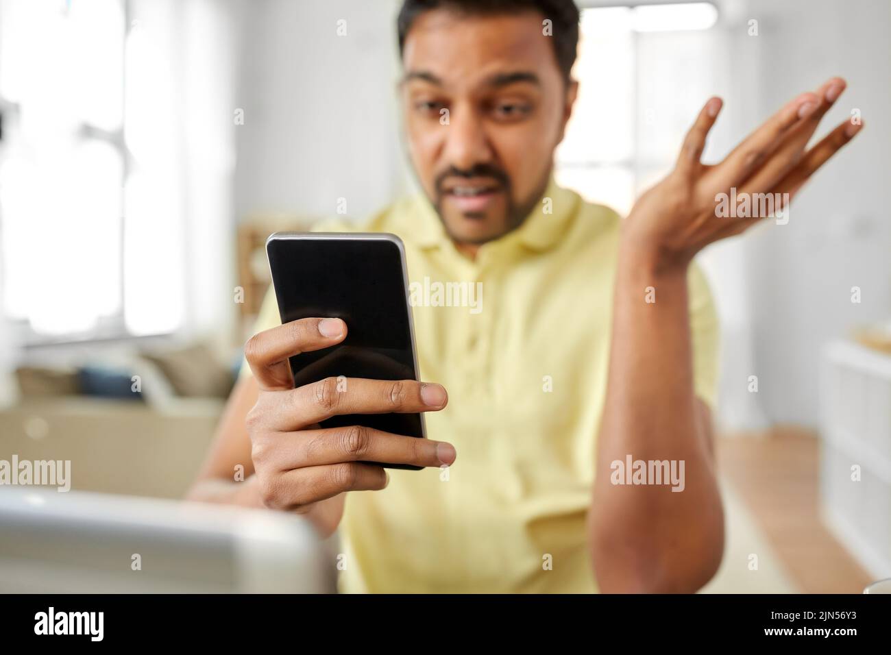 Angry indian man smartphone hi-res stock photography and images - Alamy