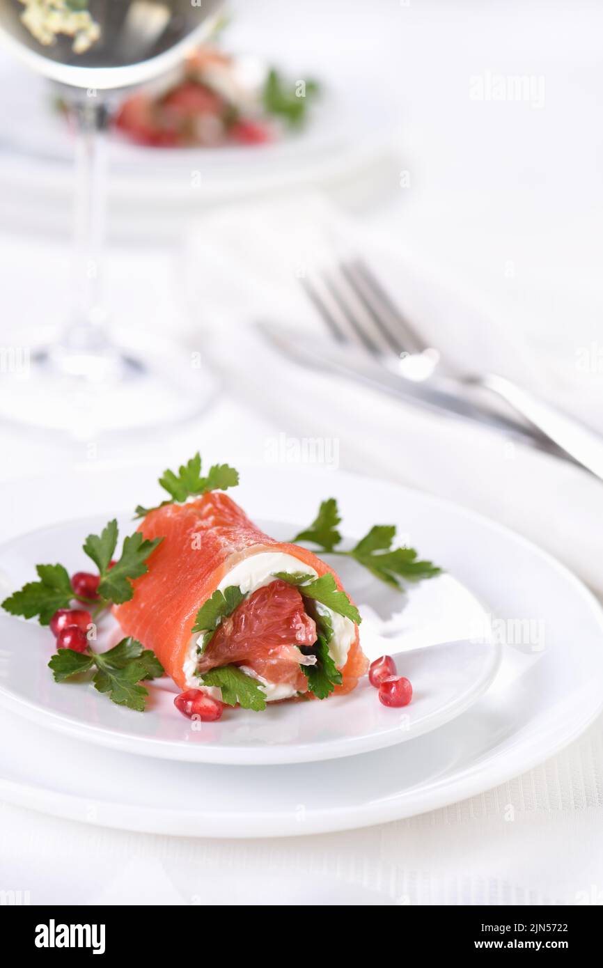 Salmon strip with cream cheese and grapefruit, rolled up. These bite ...