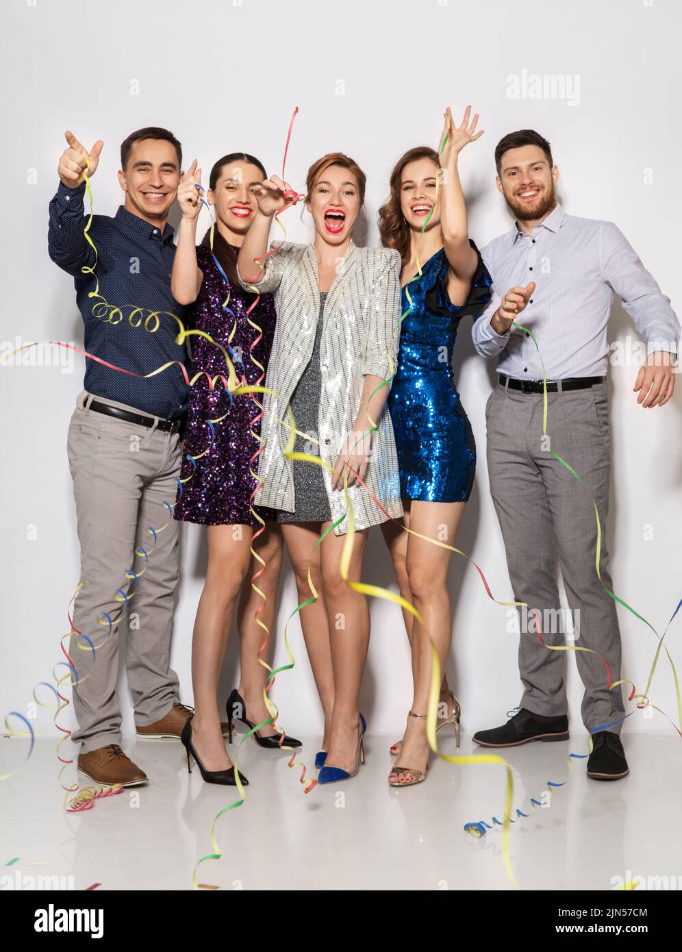 friends throwing party streamers and having fun Stock Photo - Alamy