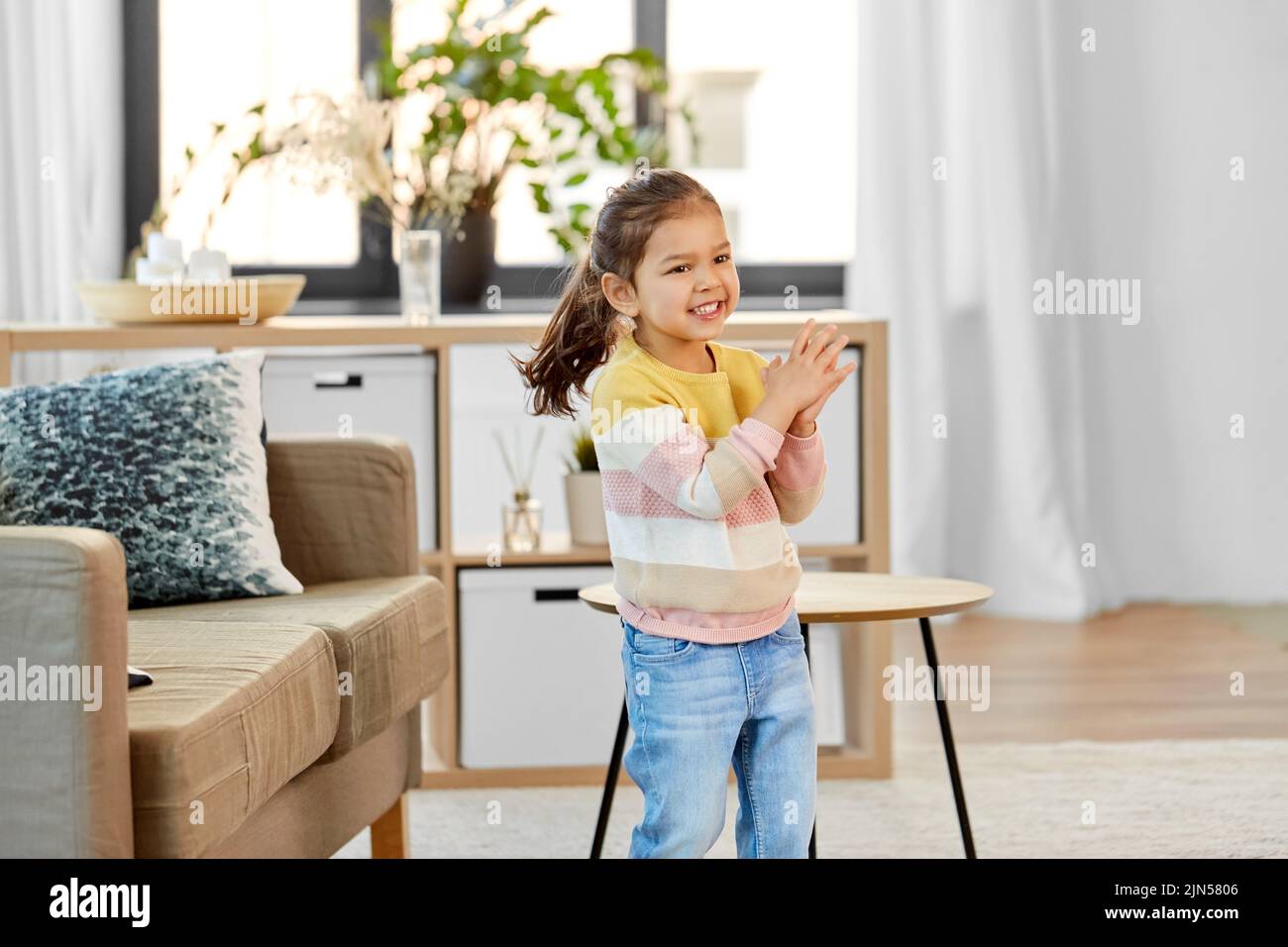 happy smiling little girl at home Stock Photo - Alamy