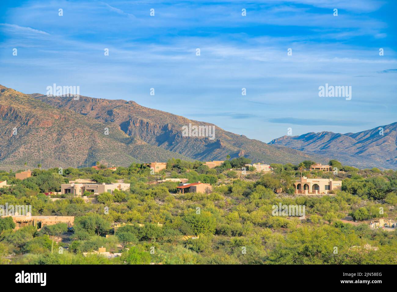 Large mediterranean houses on a sloped residential area against the ...