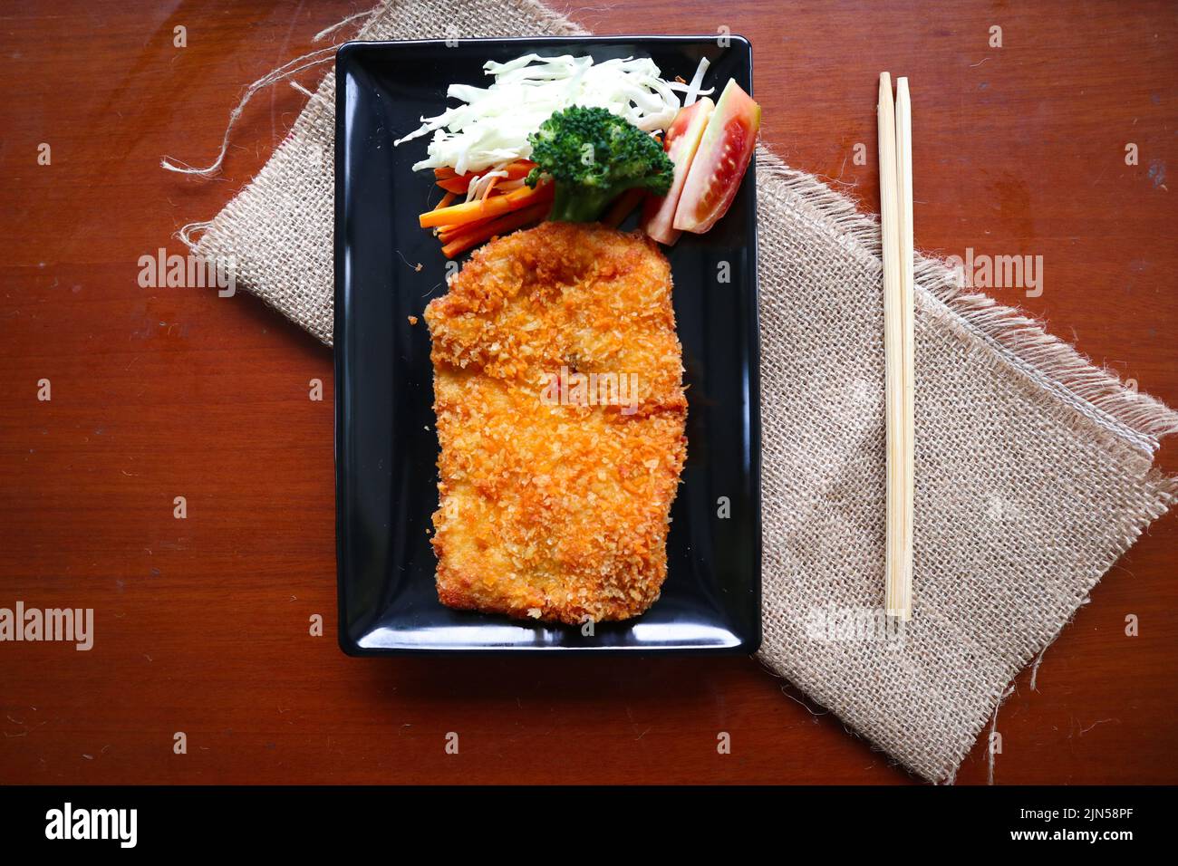 chicken katsu don is japanese food served with soy sauce on table Stock ...