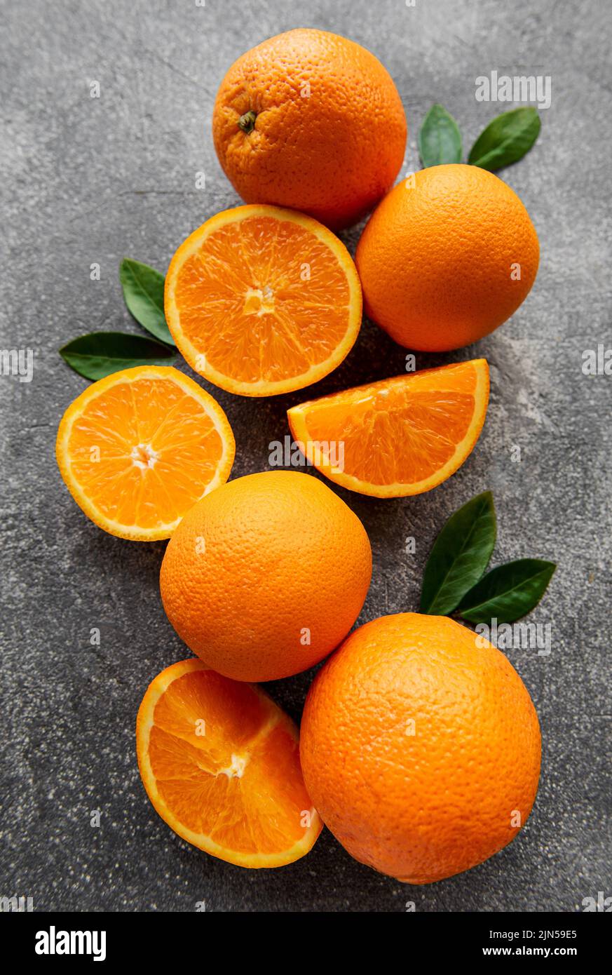 Fresh ripe oranges on dark concrete background Stock Photo - Alamy