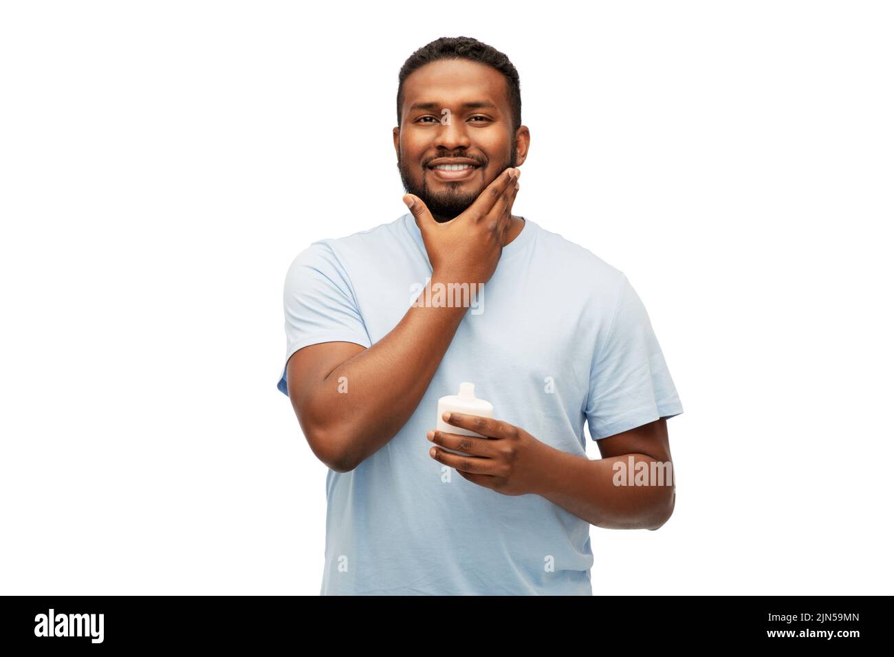 happy african man applying cream to his face Stock Photo - Alamy
