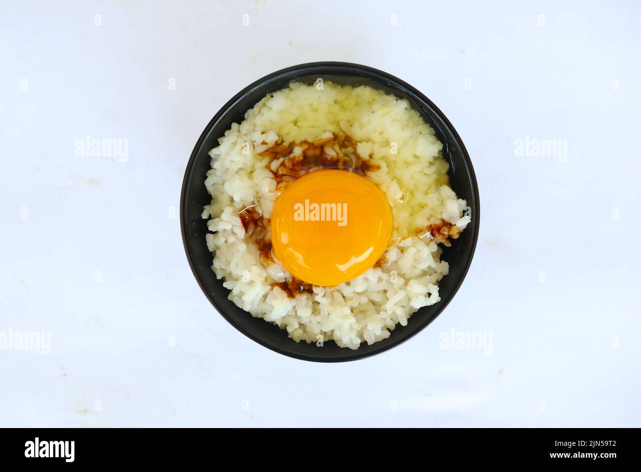 tamago kake gohan or raw egg on rice. traditional food from japan, eat ...