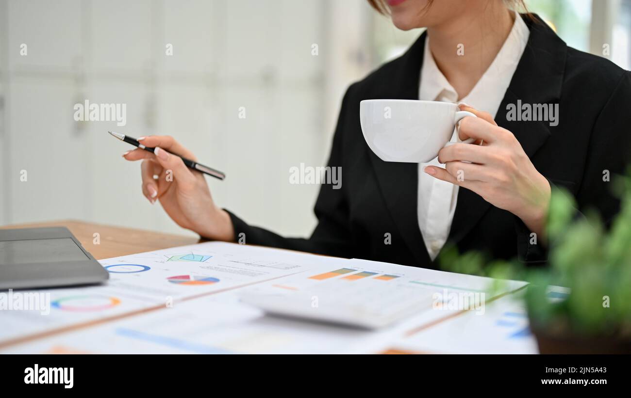 A professional Asian businesswoman or female financial worker at her ...