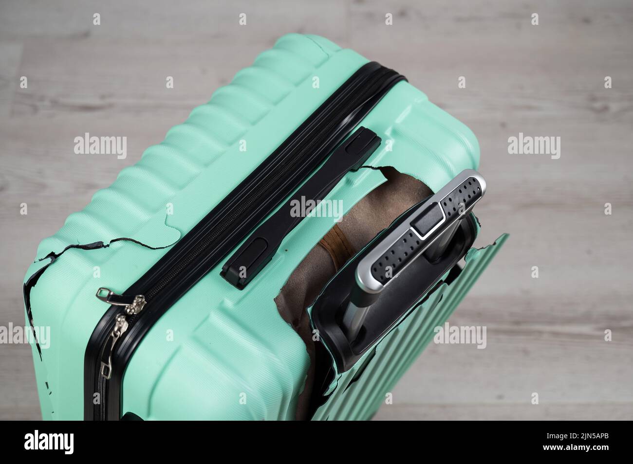 A close-up of a broken plastic suitcase Stock Photo - Alamy