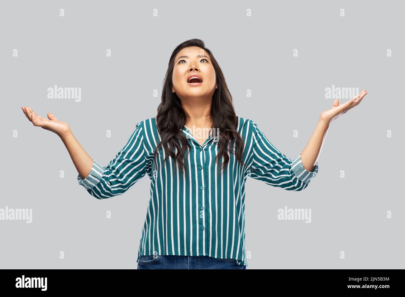 happy asian young woman looking up Stock Photo - Alamy