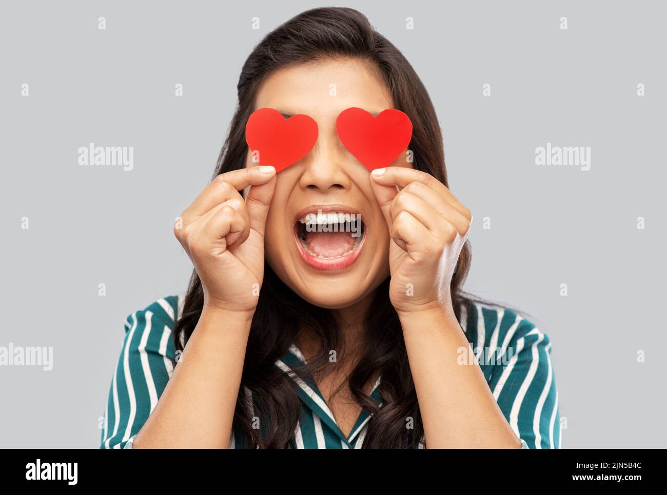 happy asian woman covering her eyes with red heart Stock Photo - Alamy