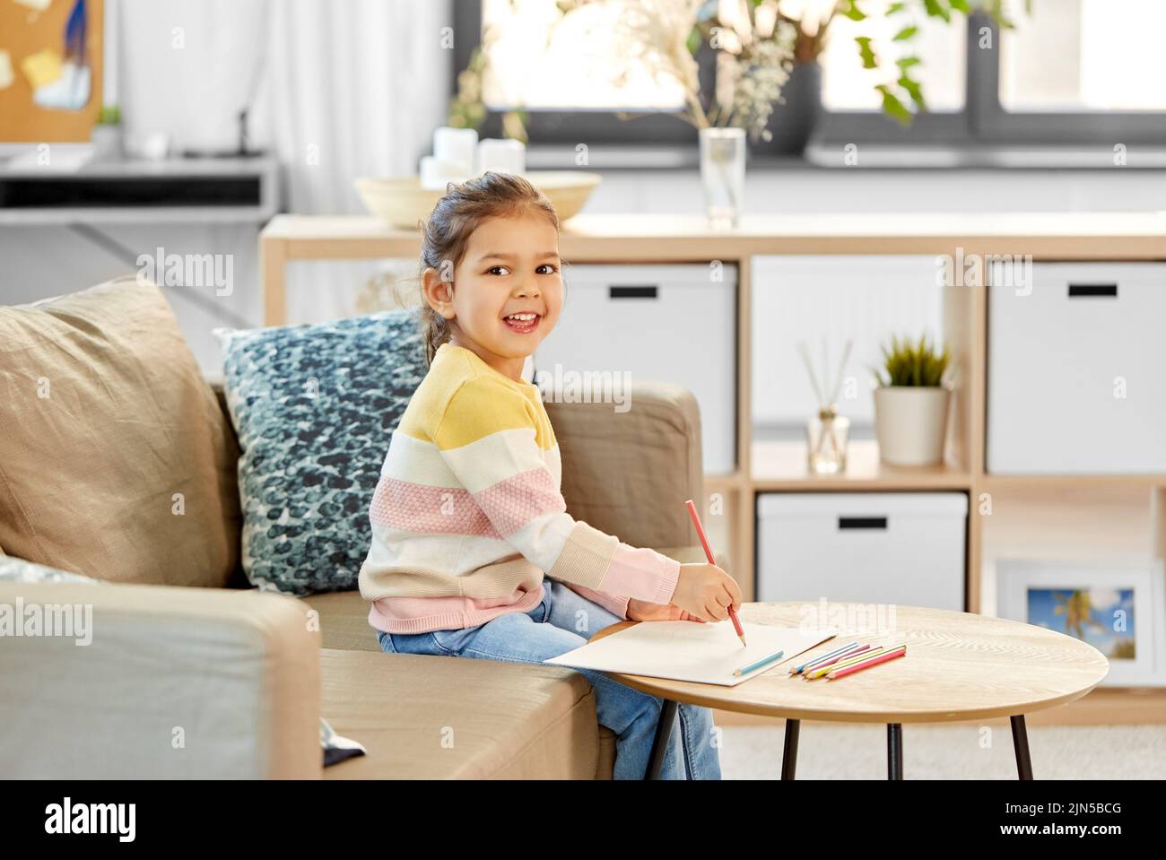 little girl drawing with coloring pencils at home Stock Photo - Alamy