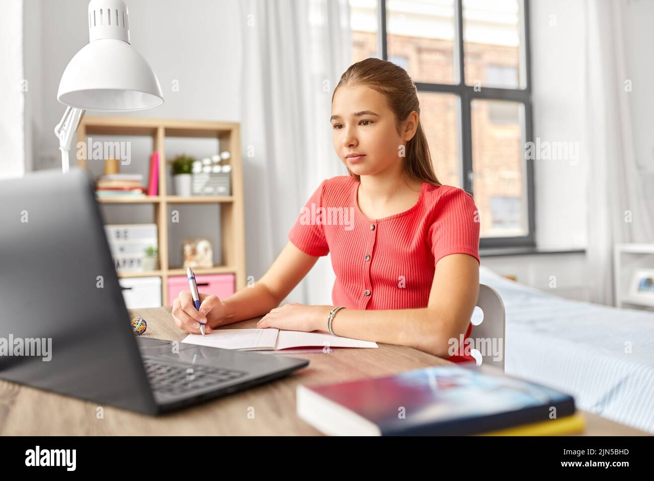 Girl hispanic desk writing pencil hi-res stock photography and images ...