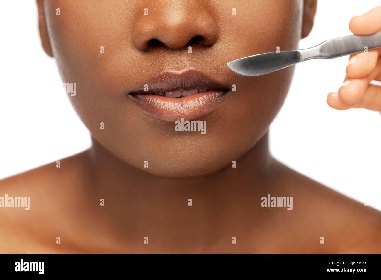 face of african american woman and scalpel knife Stock Photo - Alamy
