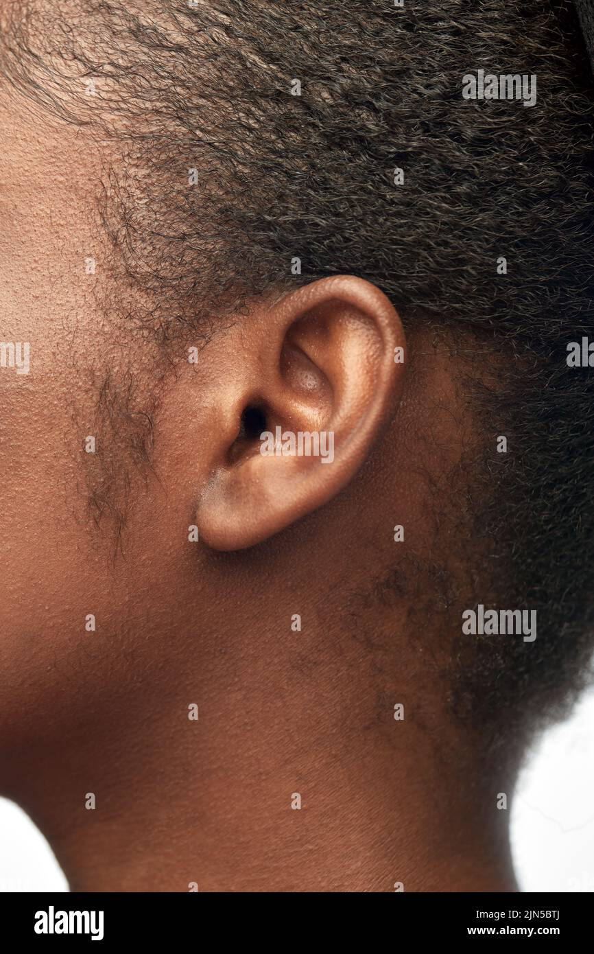 Young womans ear hi-res stock photography and images - Alamy