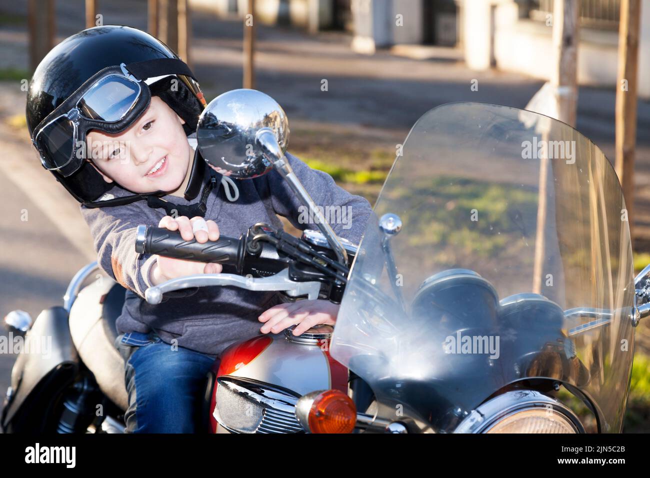 portrait a little biker on road with motorcycle Stock Photo - Alamy
