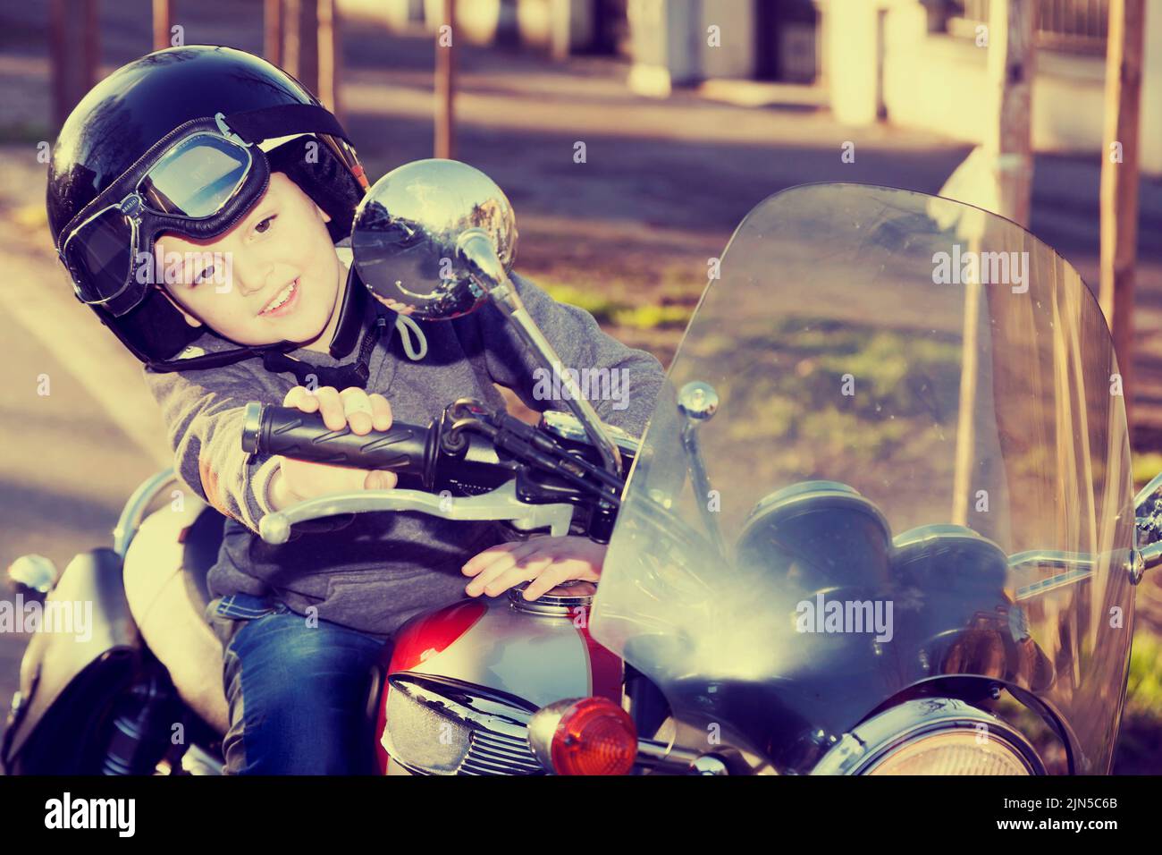 portrait a little biker on road with motorcycle Stock Photo - Alamy
