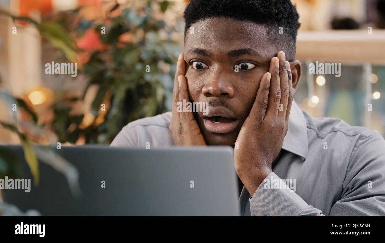 Man surprised looking at laptop hi-res stock photography and images - Alamy