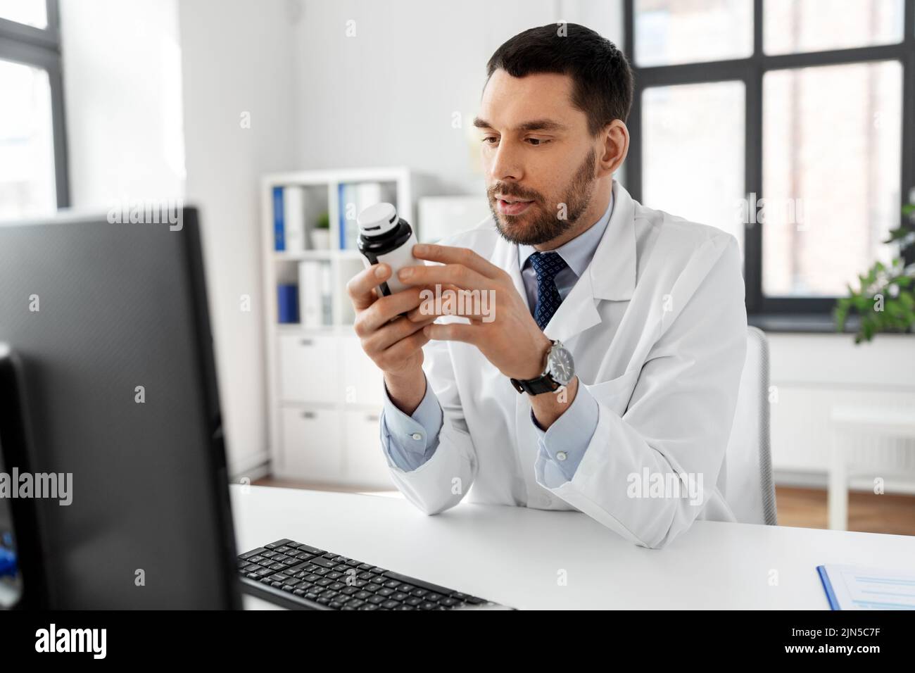 male doctor with medicine at hospital Stock Photo - Alamy