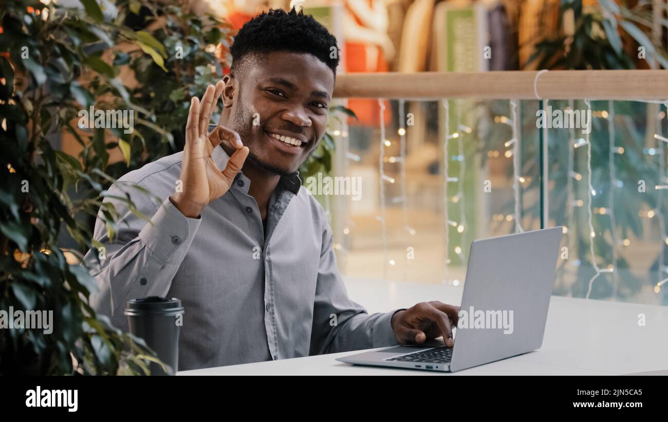 Focused confident businessman working remotely typing on laptop serious ...
