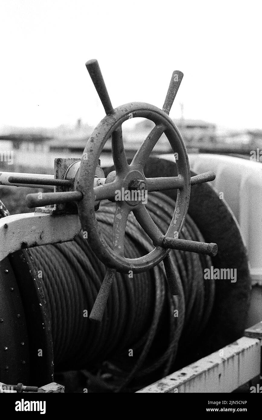 A monochrome and vertical shot of a ship's helm Stock Photo - Alamy
