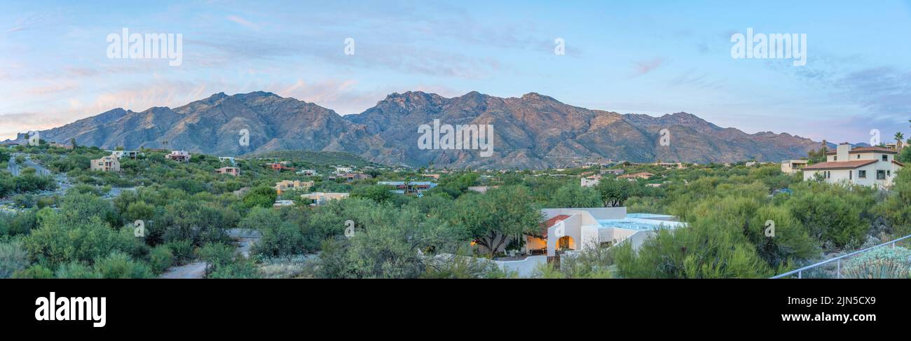 Panoramic view of a mountainside fenced upper middle class residences ...