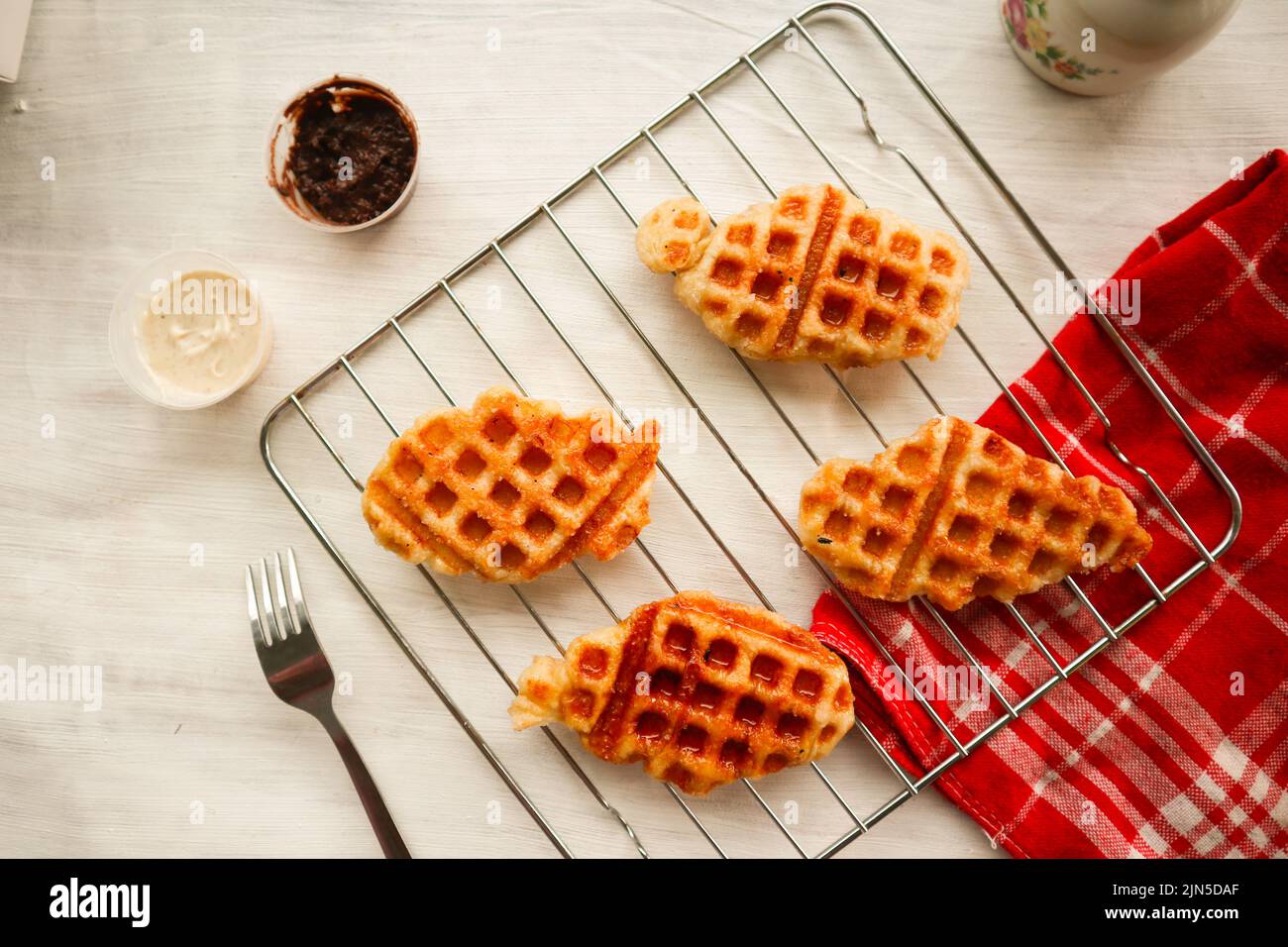 Croissant Waffle or Croffle with chocolate sauce served in box and ...