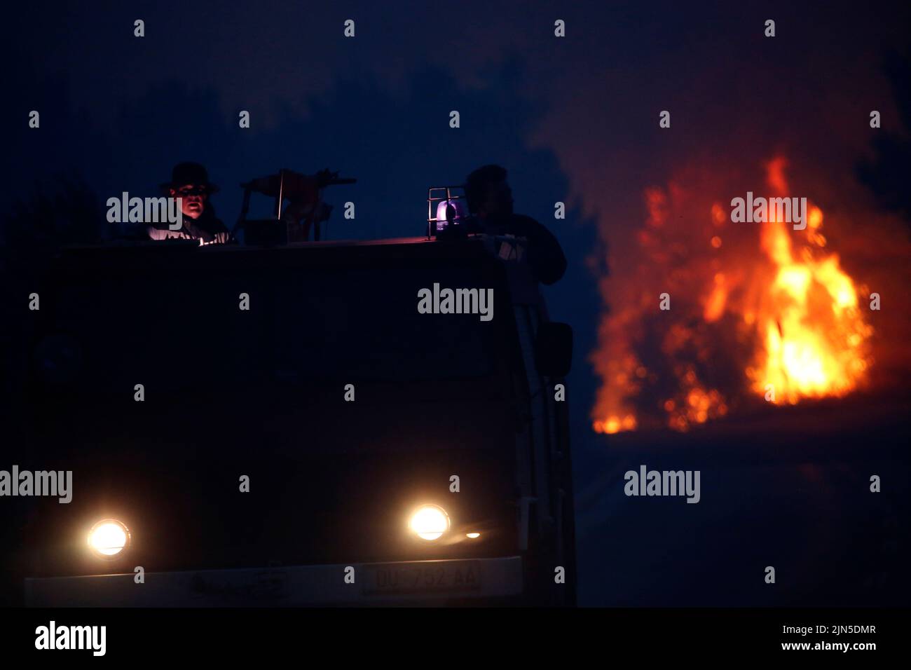 Croatian fire workers controls fire during forest fire on the Peljesec ...