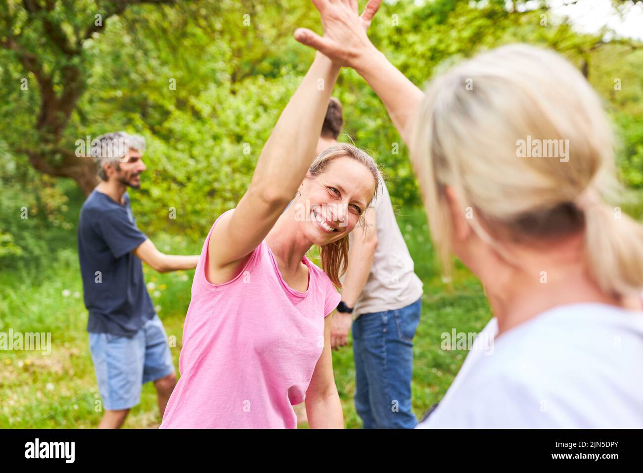 Two women giving high fives after a competition for motivation and ...