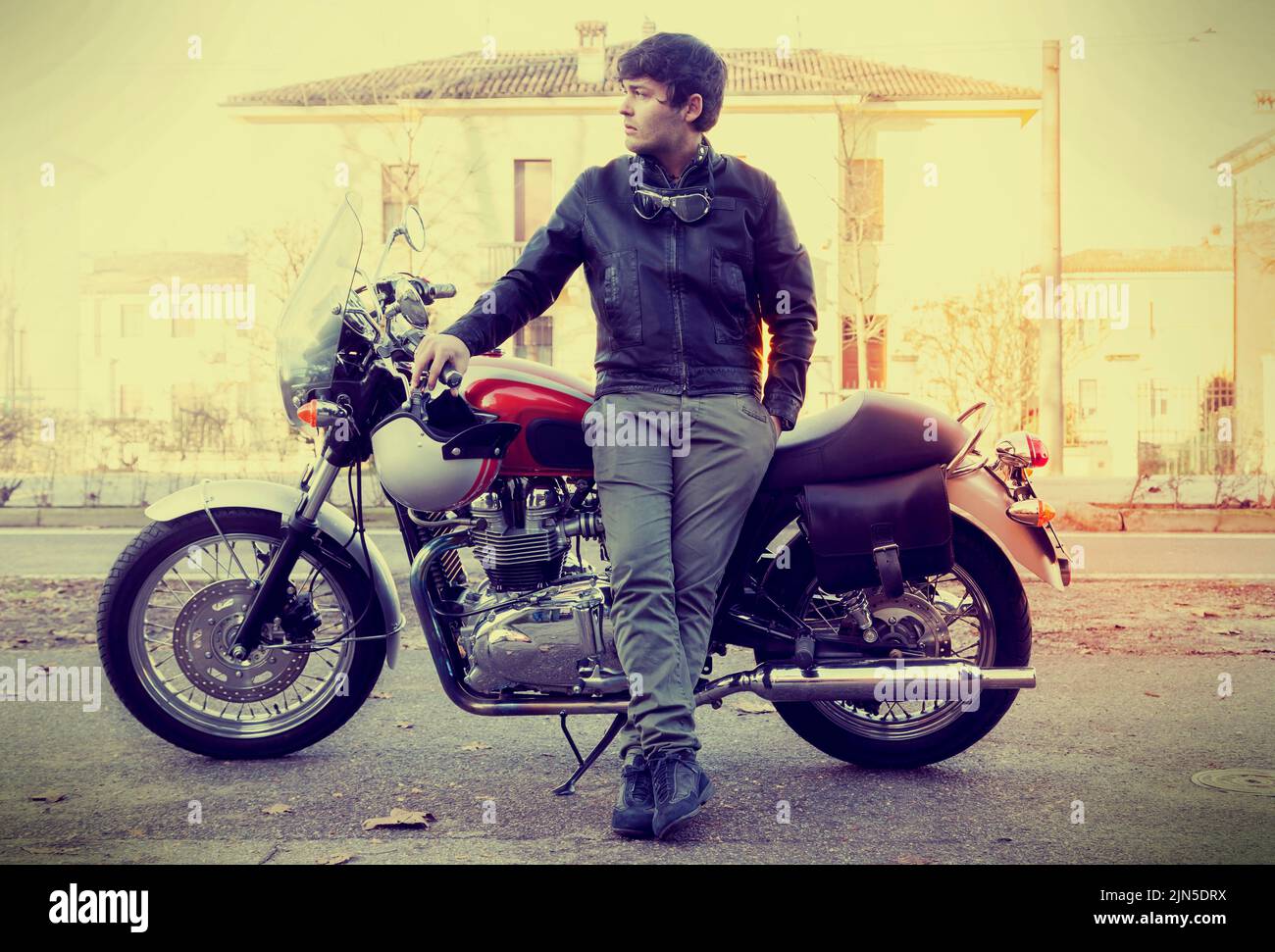 young biker relaxing leaning your motorcycle Stock Photo - Alamy