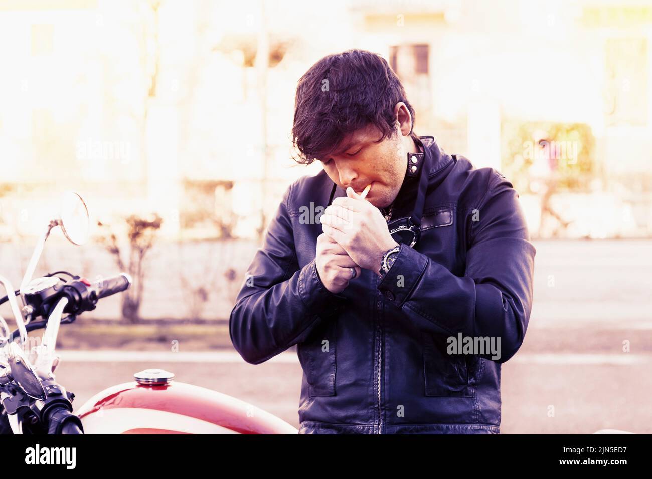 Smoking motorbike jacket hi-res stock photography and images - Alamy