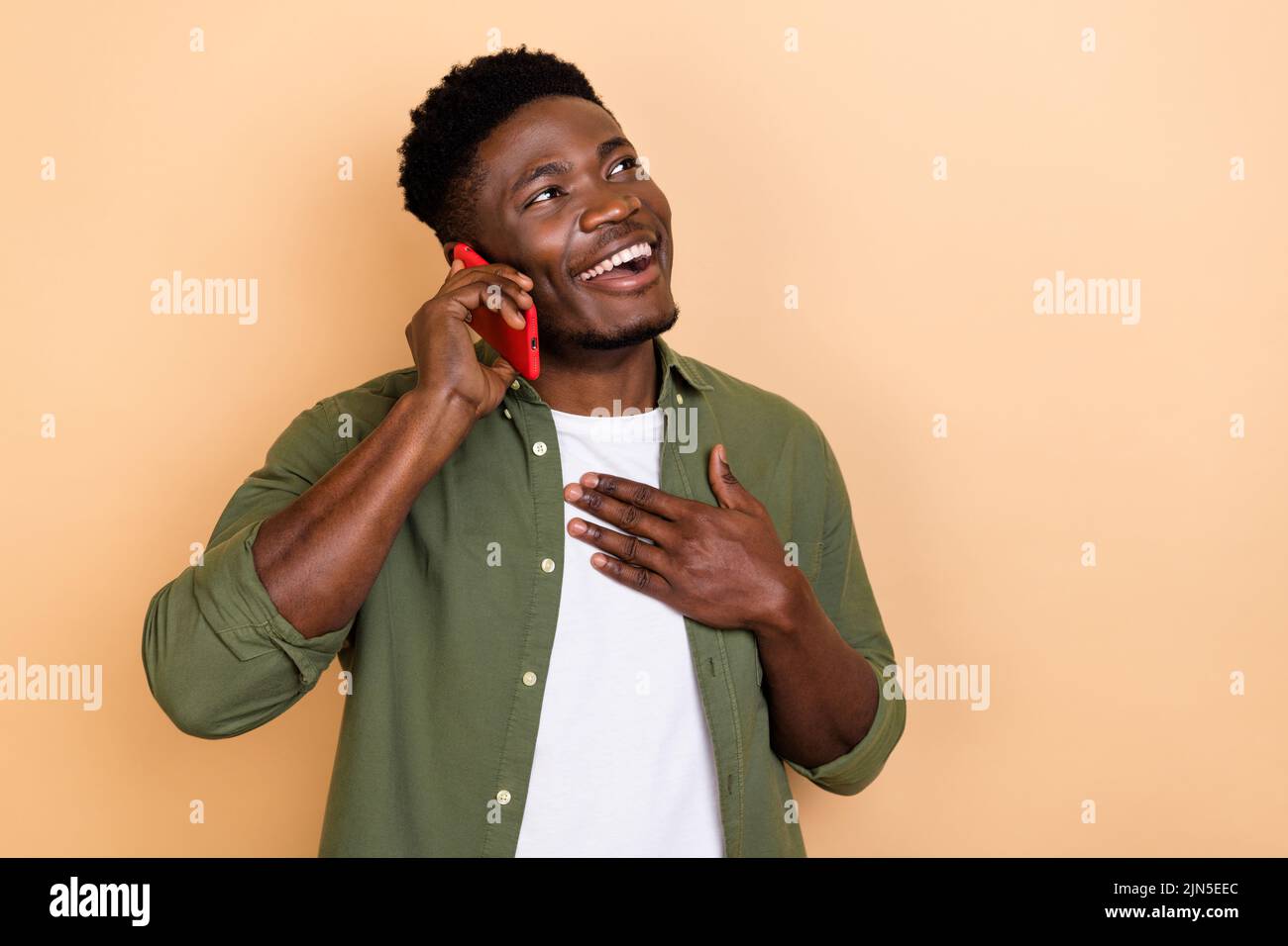 Photo of amazed crazy guy chatting with friend on smart device isolated ...