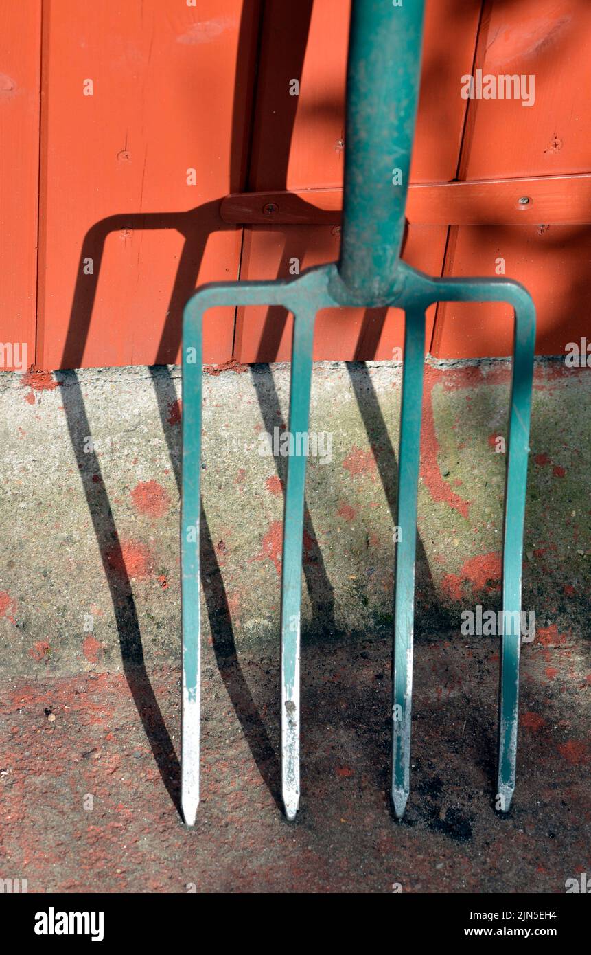 garden fork and shadow Stock Photo - Alamy